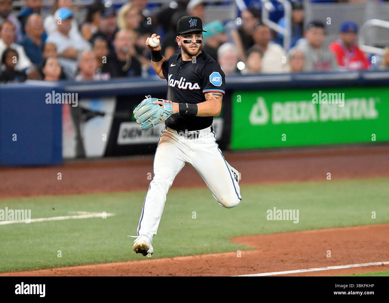 Miami Marlins third baseman Connor Norby holds the ball hit by Atlanta ...