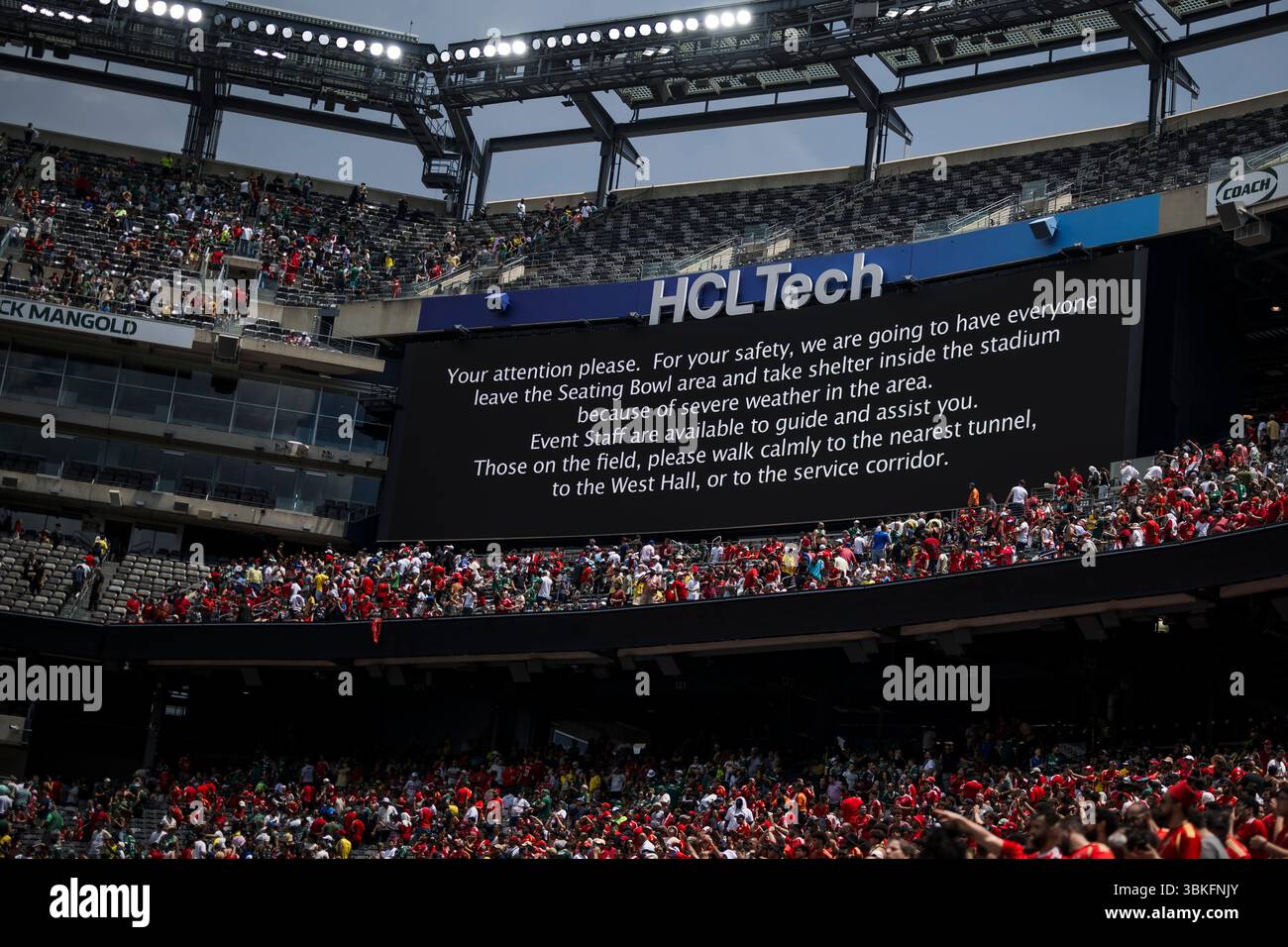 A giant screen display a notice that the match is suspended due to ...