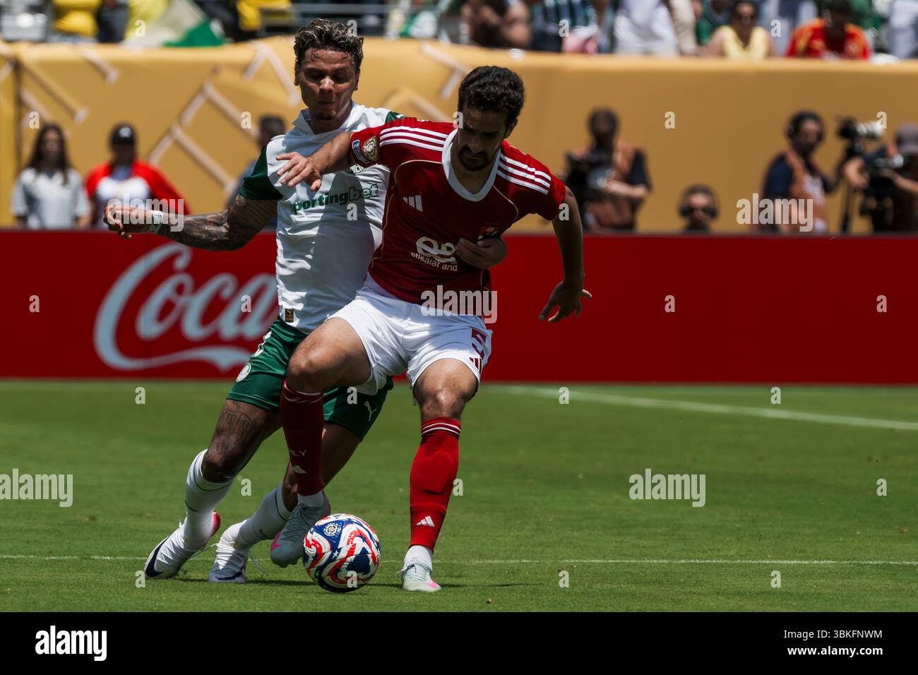 Mohamed Ali Ben Romdhane of Al Ahly FC comeptes for the ball with ...