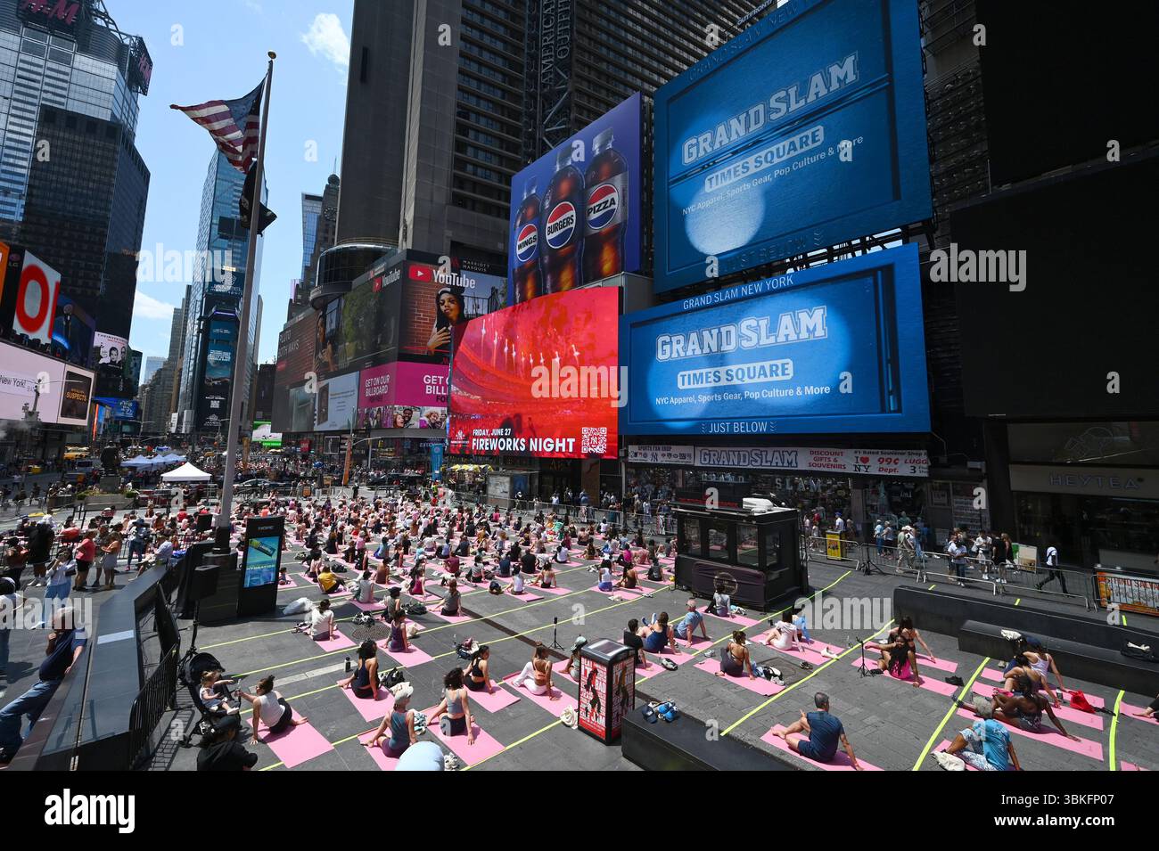 New York, USA. 20th June, 2025. A participant strikes a yoga pose ...