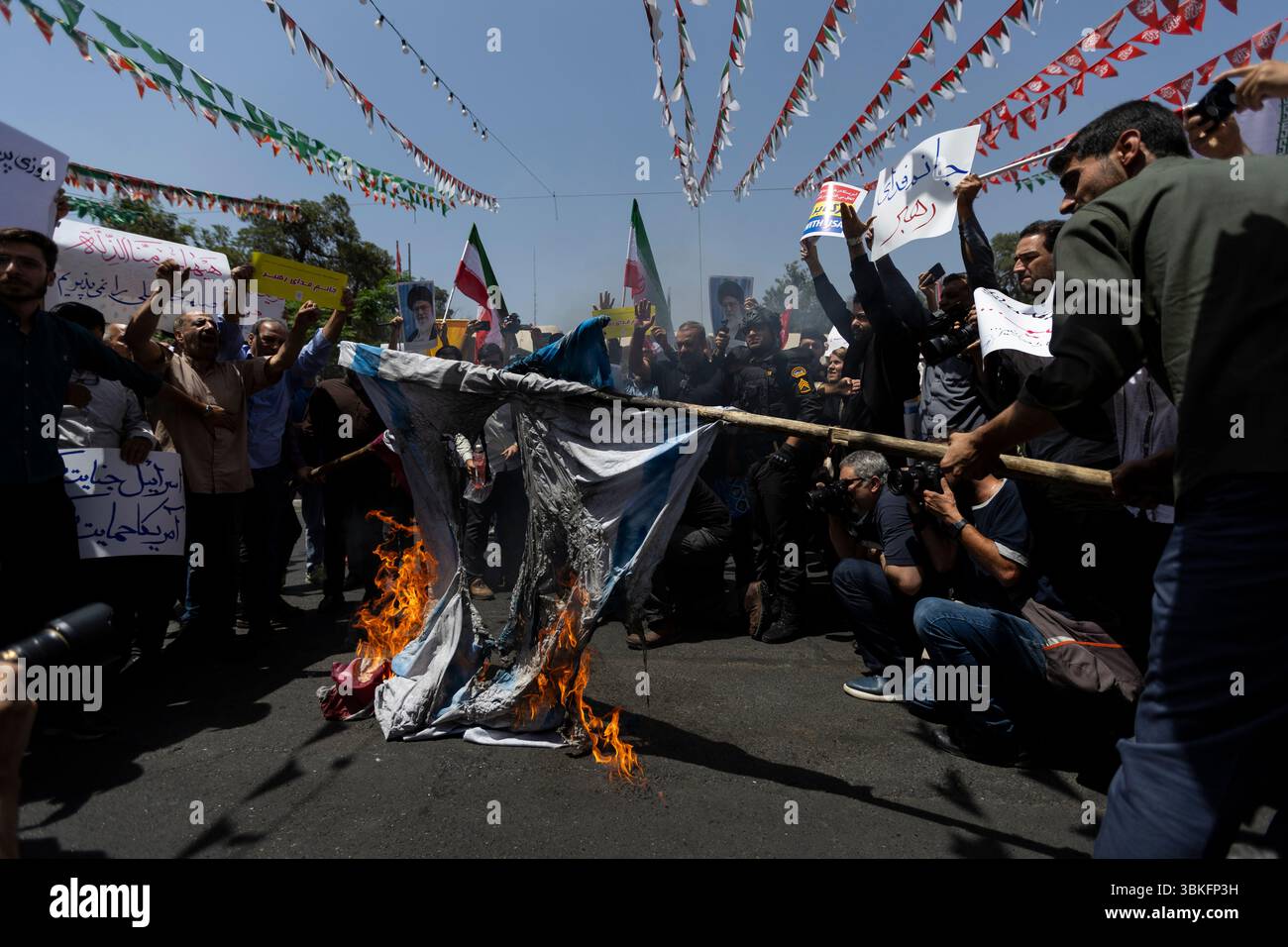 Tehran, Tehran, Iran. 20th June, 2025. Iranian protesters burn of the ...