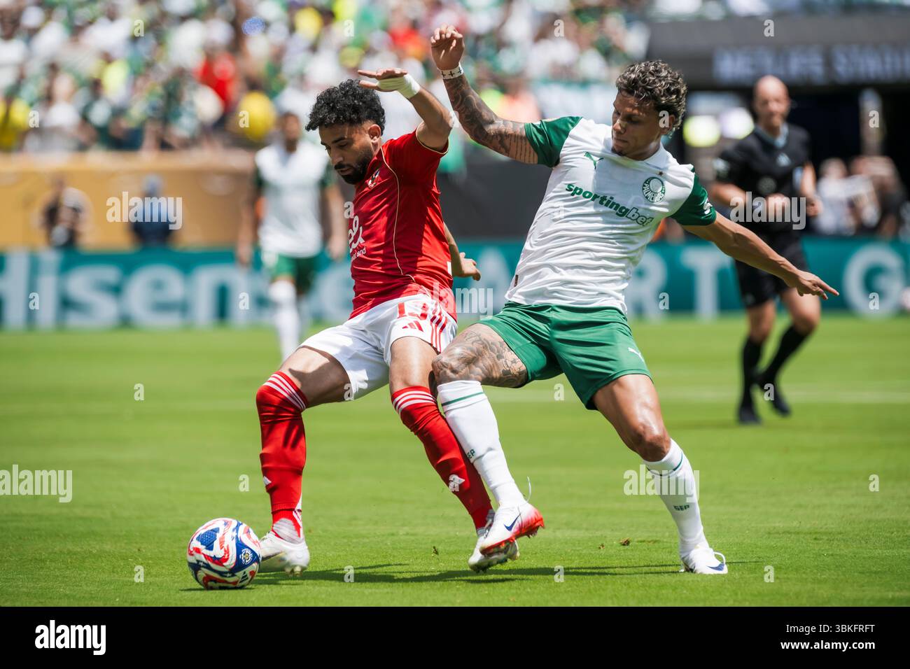 Marawan Attia of Al Ahly FC competes for the ball with Richard Rios of ...