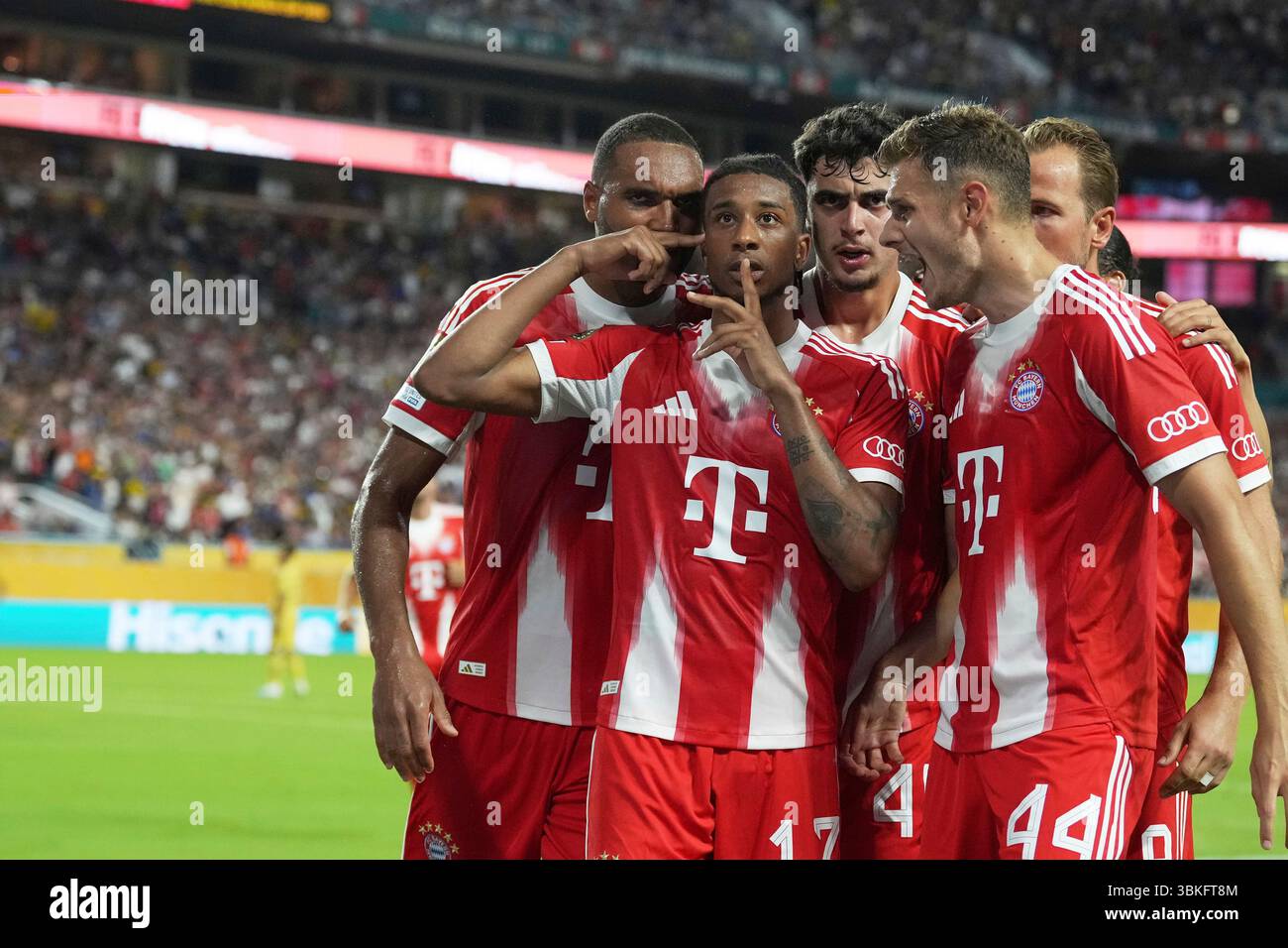 Bayern Munich's Michael Olise, second from left, celebrates scoring his ...