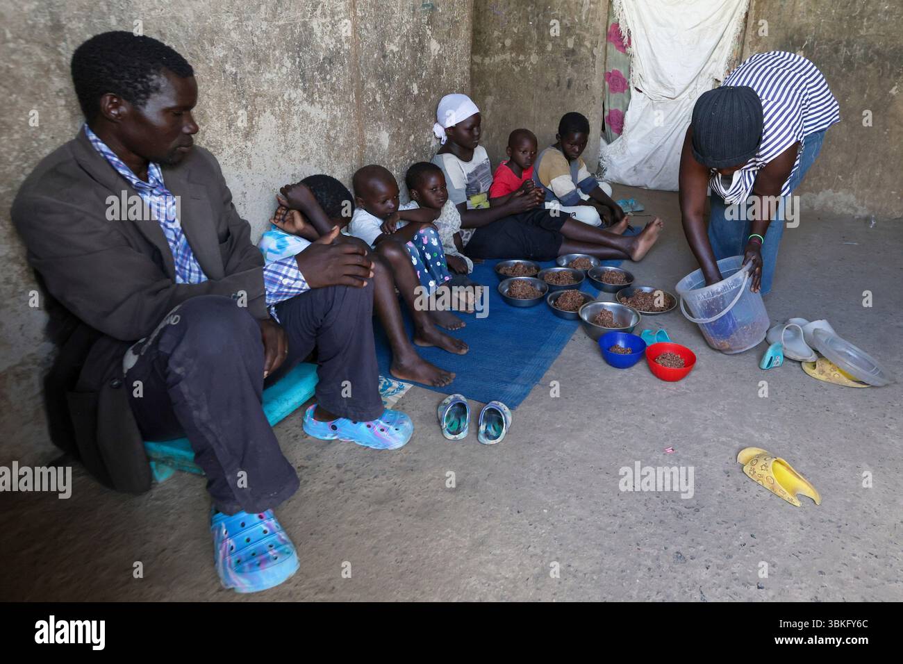 Aujene Cimanimpaye, from the Democratic Republic of Congo, gives food ...