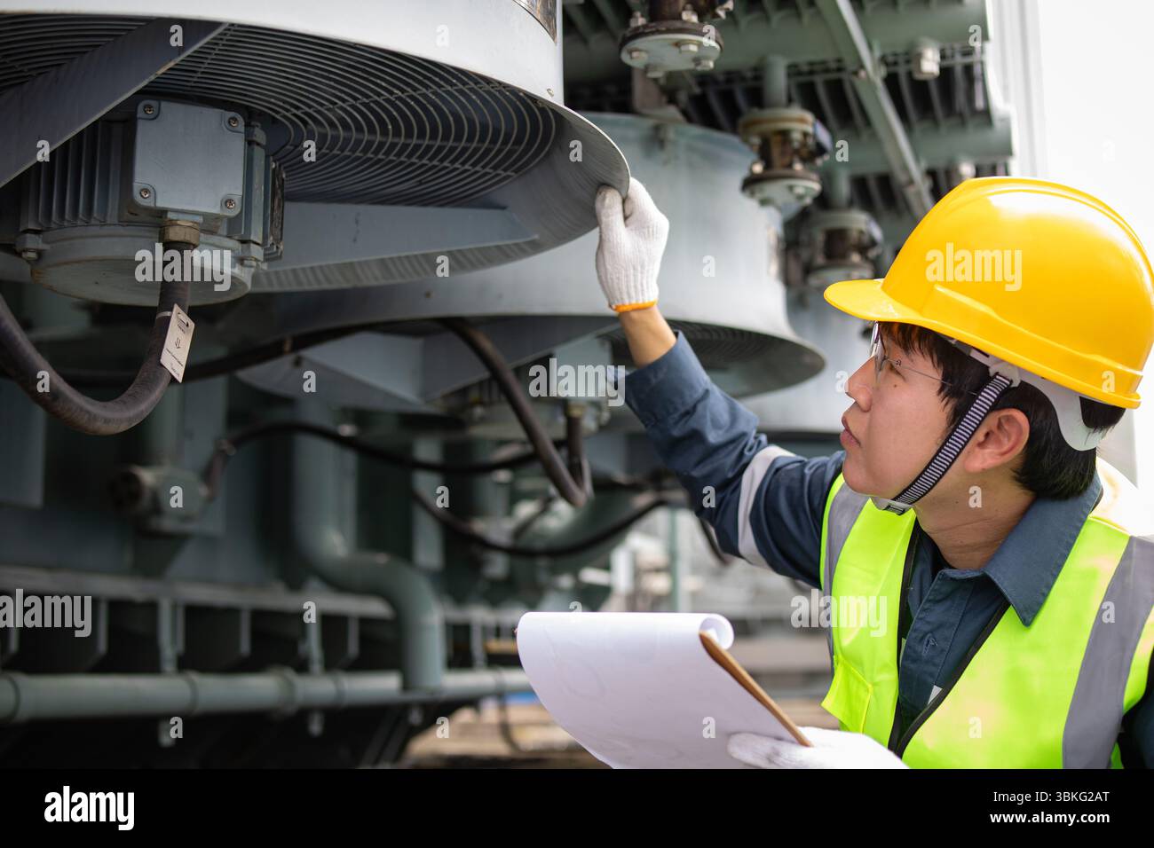 An inspection of transformer cooling system in substation is performed ...