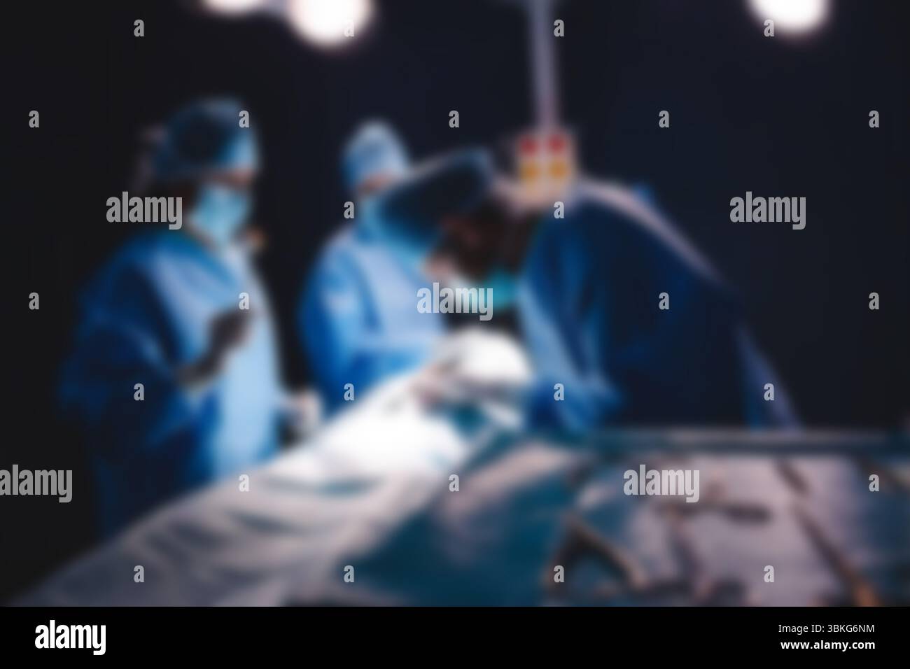 Surgery team operating a patient in an operating room Stock Photo - Alamy