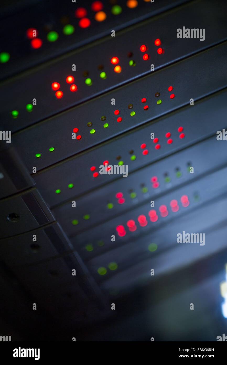 Flat design rack-mounted servers showing glowing red amber green LED ...