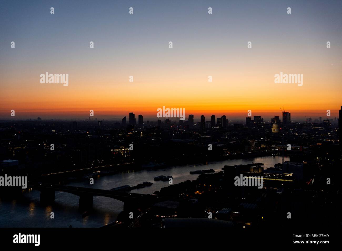 The sun rises over London, viewed from the London Eye during the summer ...
