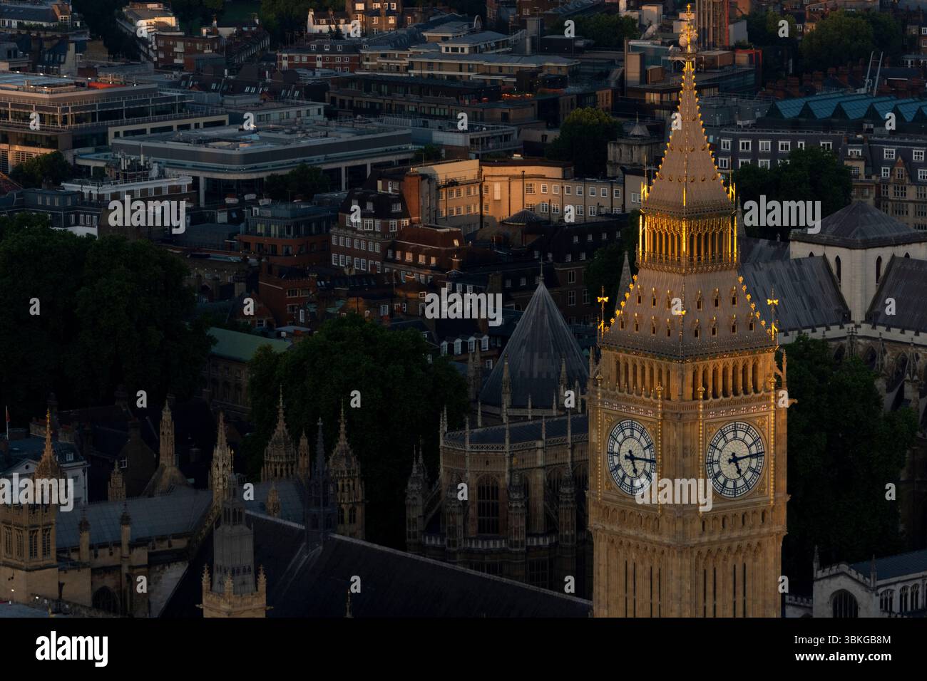 The sun rises over the Houses of Parliament in London, viewed from a ...