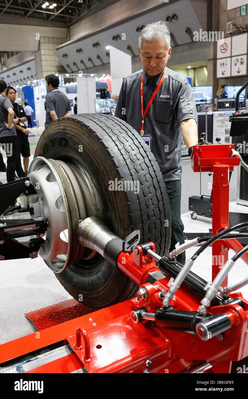 An exhibitor demonstrates the latest in automobile maintenance and ...