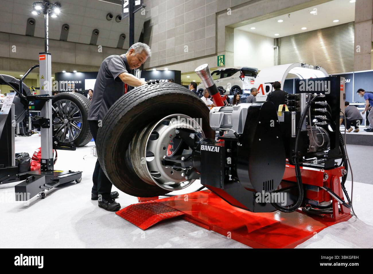 An exhibitor demonstrates the latest in automobile maintenance and ...
