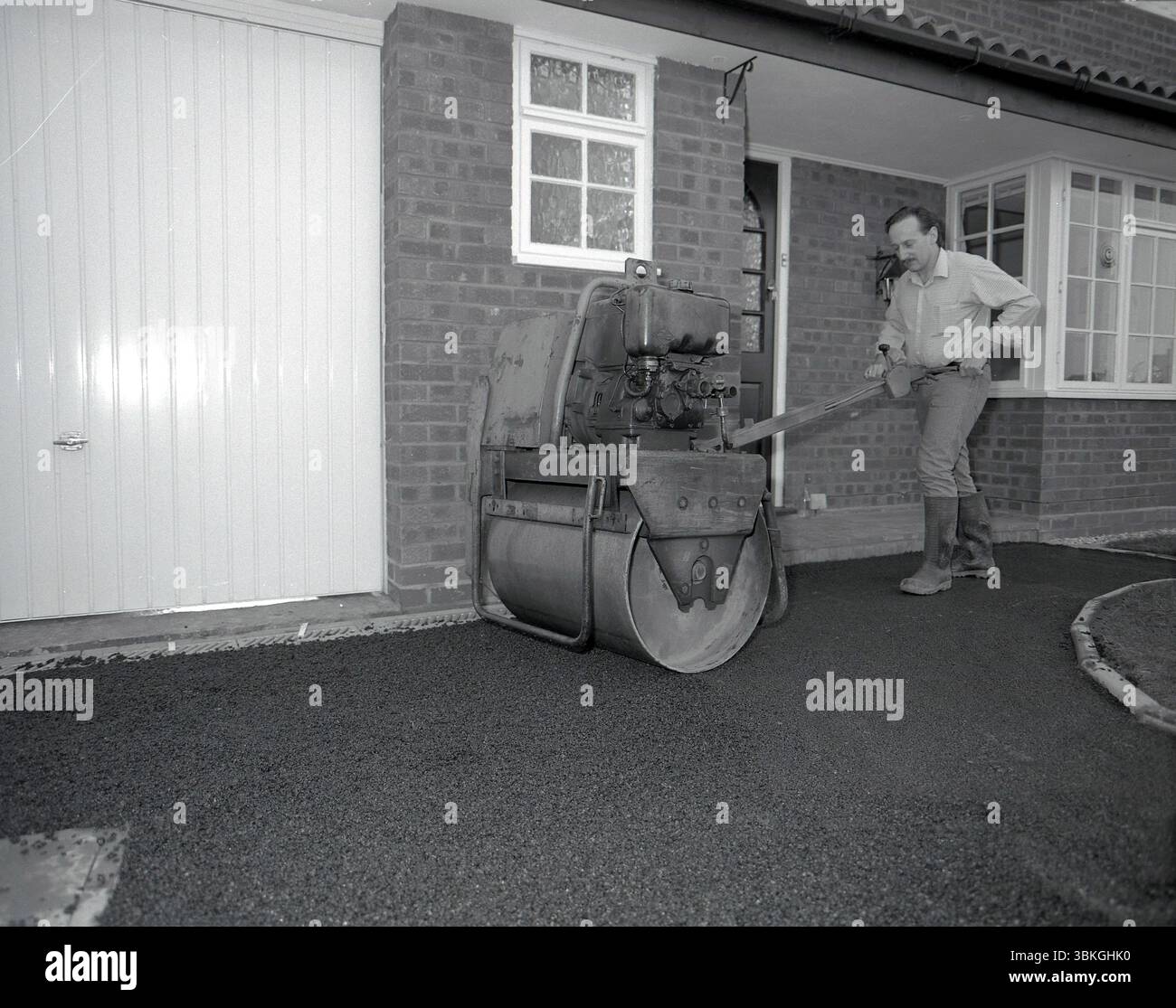 1980s, house, new driveway, rolling tarmac Stock Photo - Alamy
