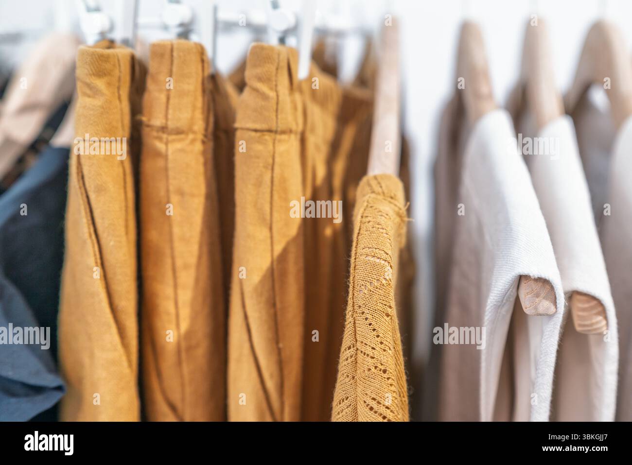 textile patterns and textures on a clothing rack wardrobe refresh with ...