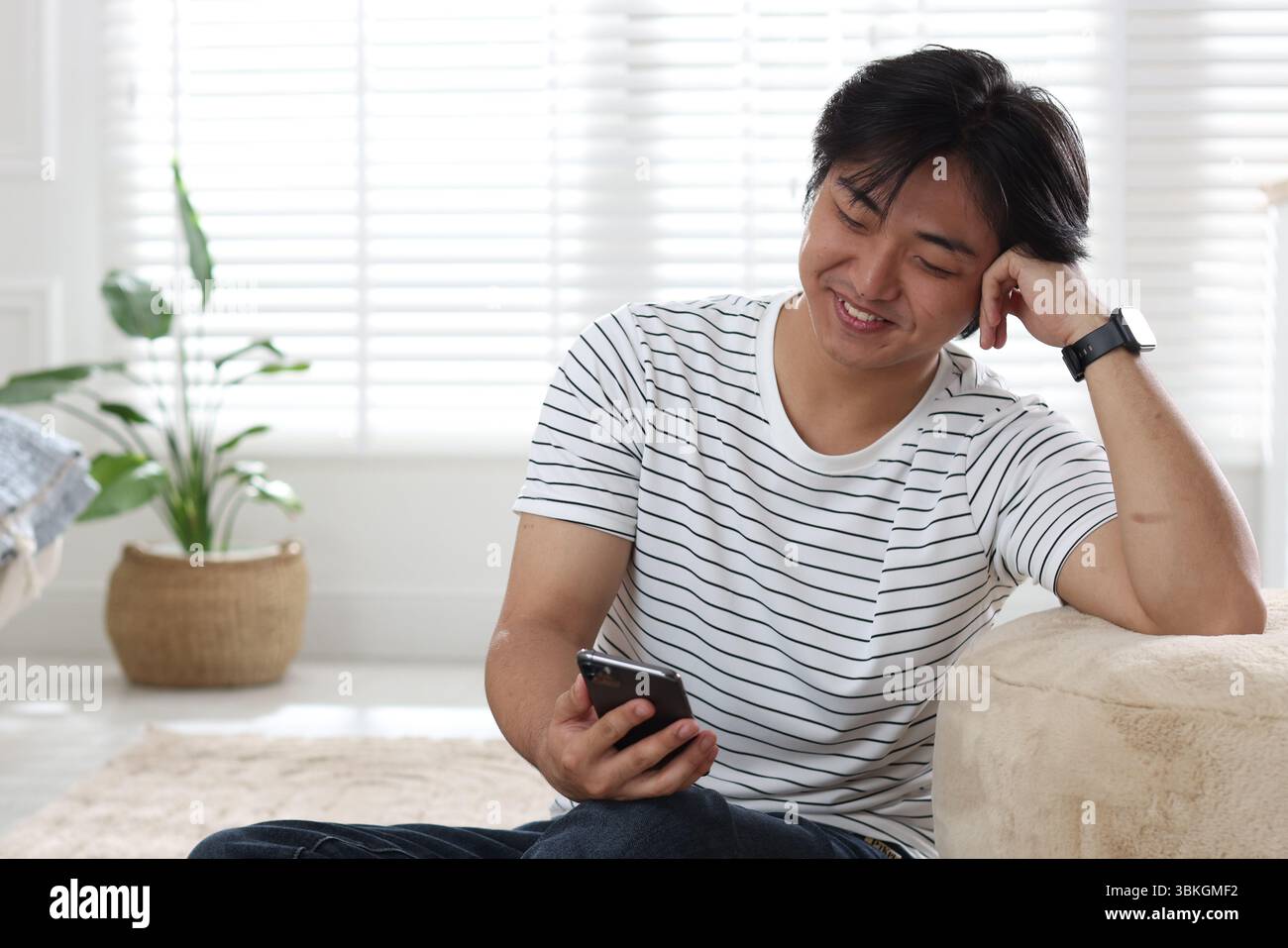 Smiling asian guy house hi-res stock photography and images - Alamy