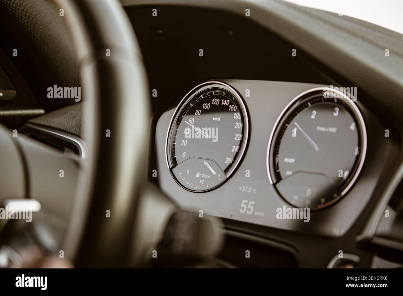 Close up view of a contemporary car dashboard displaying current speed ...
