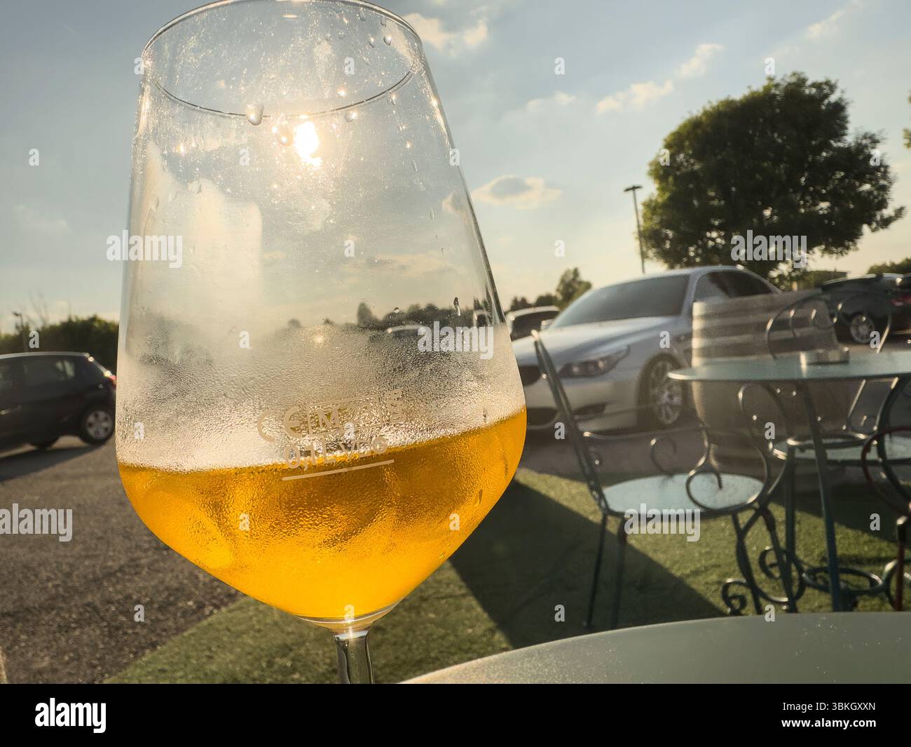 Milan, italy 21 june 2025, chilled golden beverage glistening with ...
