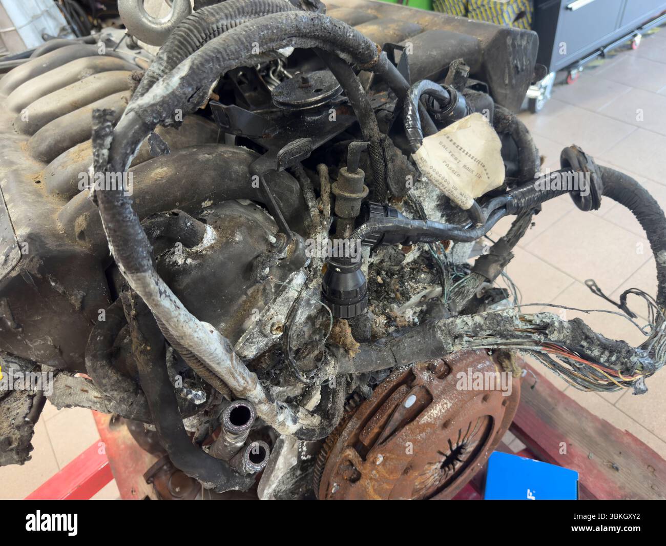 Milan, italy 21 june 2025, close up of a damaged car engine revealing ...