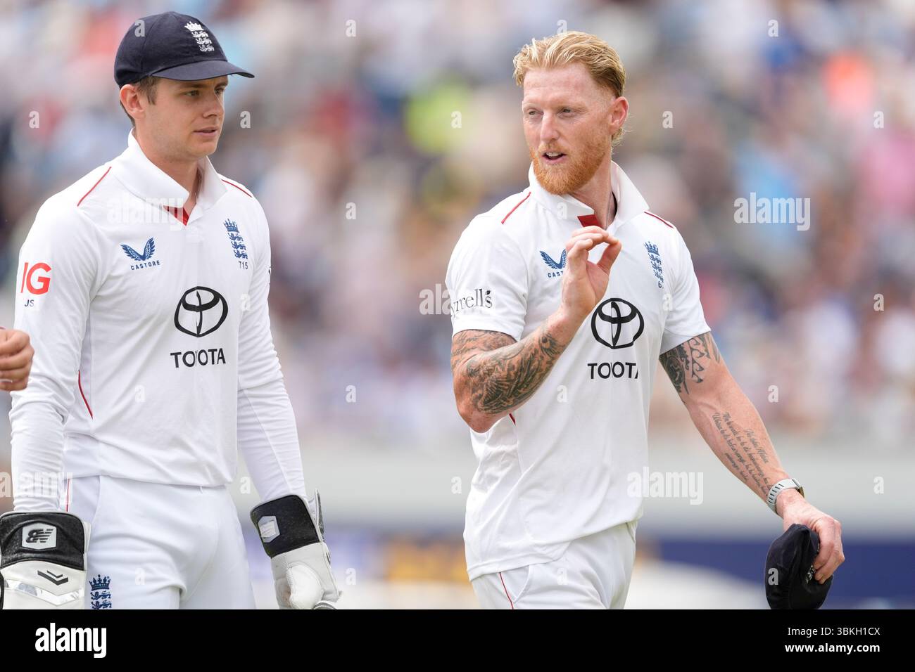 England’s Ben Stokes (right) and Jamie Smith leave the field for lunch ...