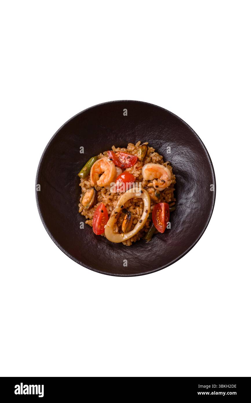 Rice and prawns or paella, a meal with seafood and vegetables. Cooked ...