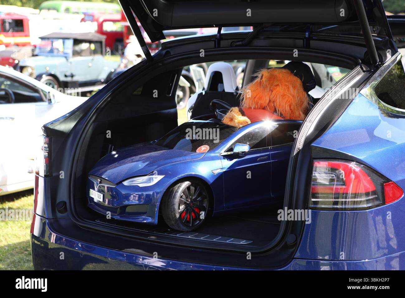 Small version of Tesla model 3 inside boot trunk of real size Tesla ...