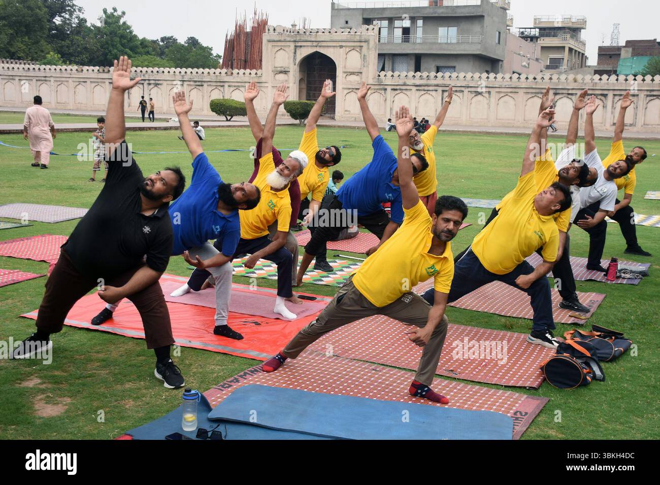 Lahore, Pakistan. 21st June, 2025. Participants take part in a yoga ...