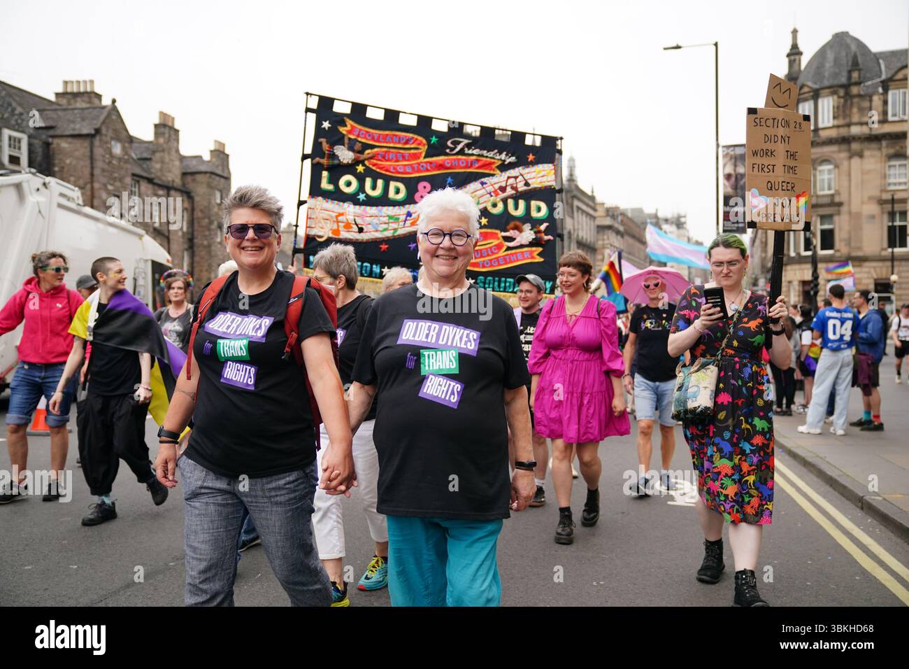 Author Val McDermid (centre) and wife Jo Sharp (centre left) take part ...