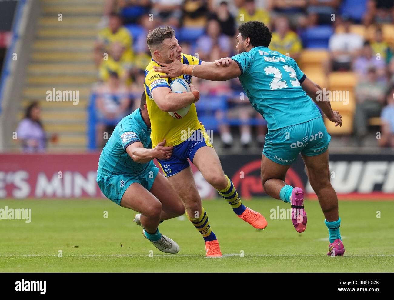 Warrington Wolves' Connor Wrench is tackled by Huddersfield Giants ...