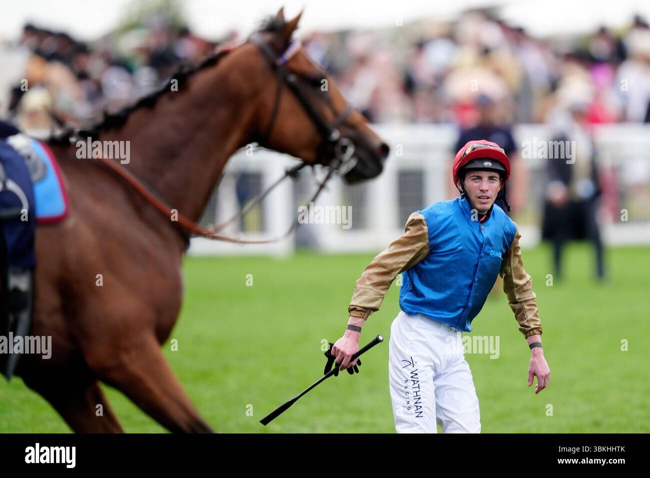 James Doyle looks on towards Lazzat after being unseated after winning ...