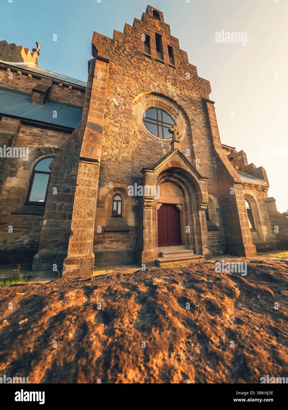 Medieval castle church against sunset sky. Ancient historical monuments ...
