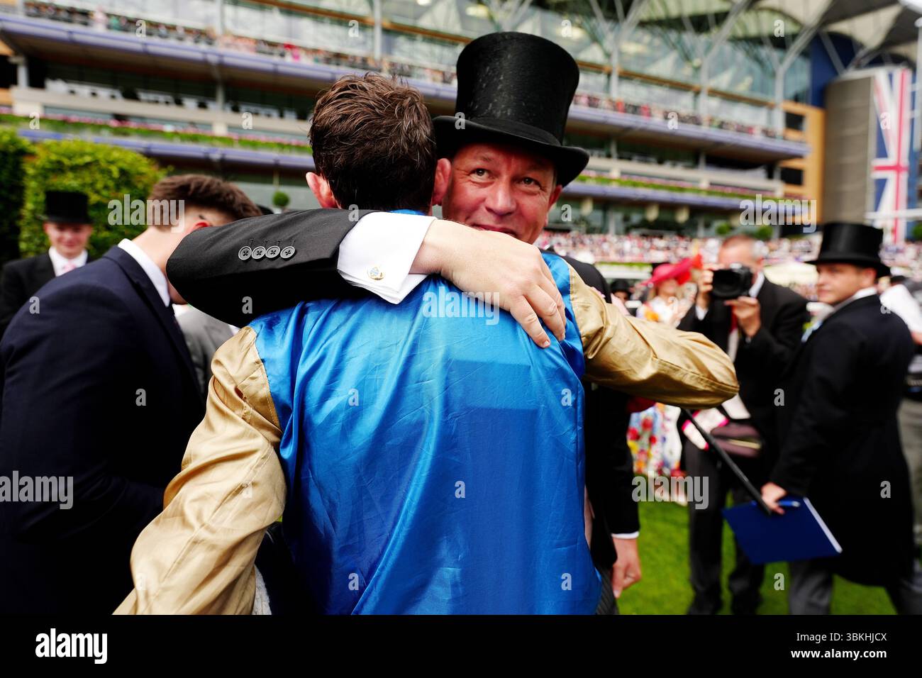 Jockey James Doyle is embraced by Agent Richard Brown after winning the ...