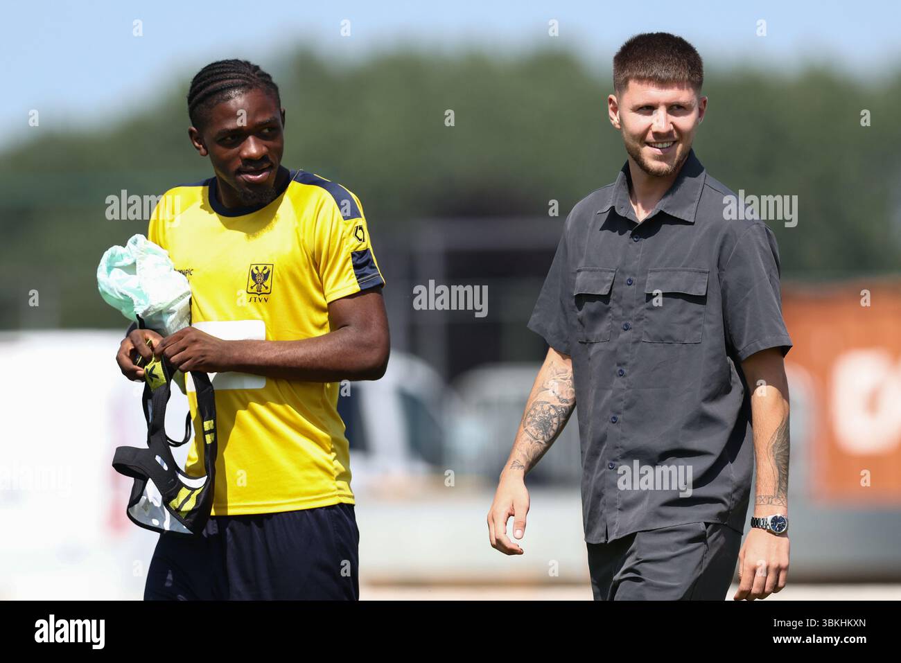 STVV's Alan Loic Mbega Evouna and STVV's new player Ryan Merlen pictured before a friendly ...