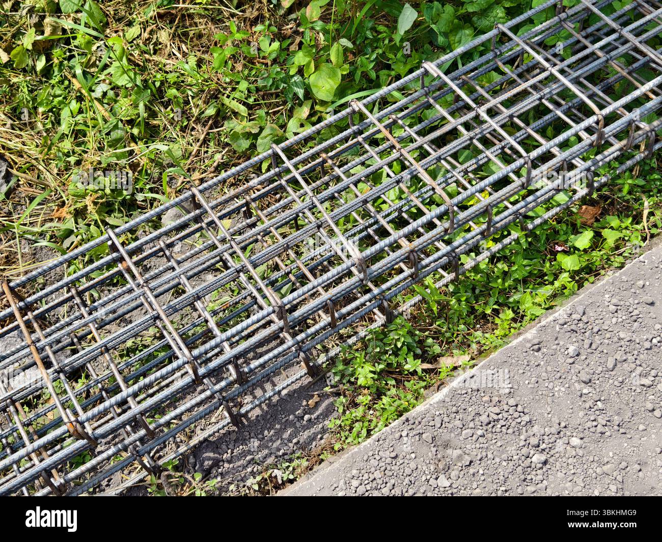A steel reinforcement cage made of rebar and stirrups, tied together to ...