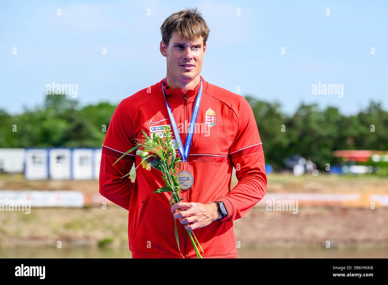 Winner Adam Varga of Hungary poses with his medal after the K1 category ...