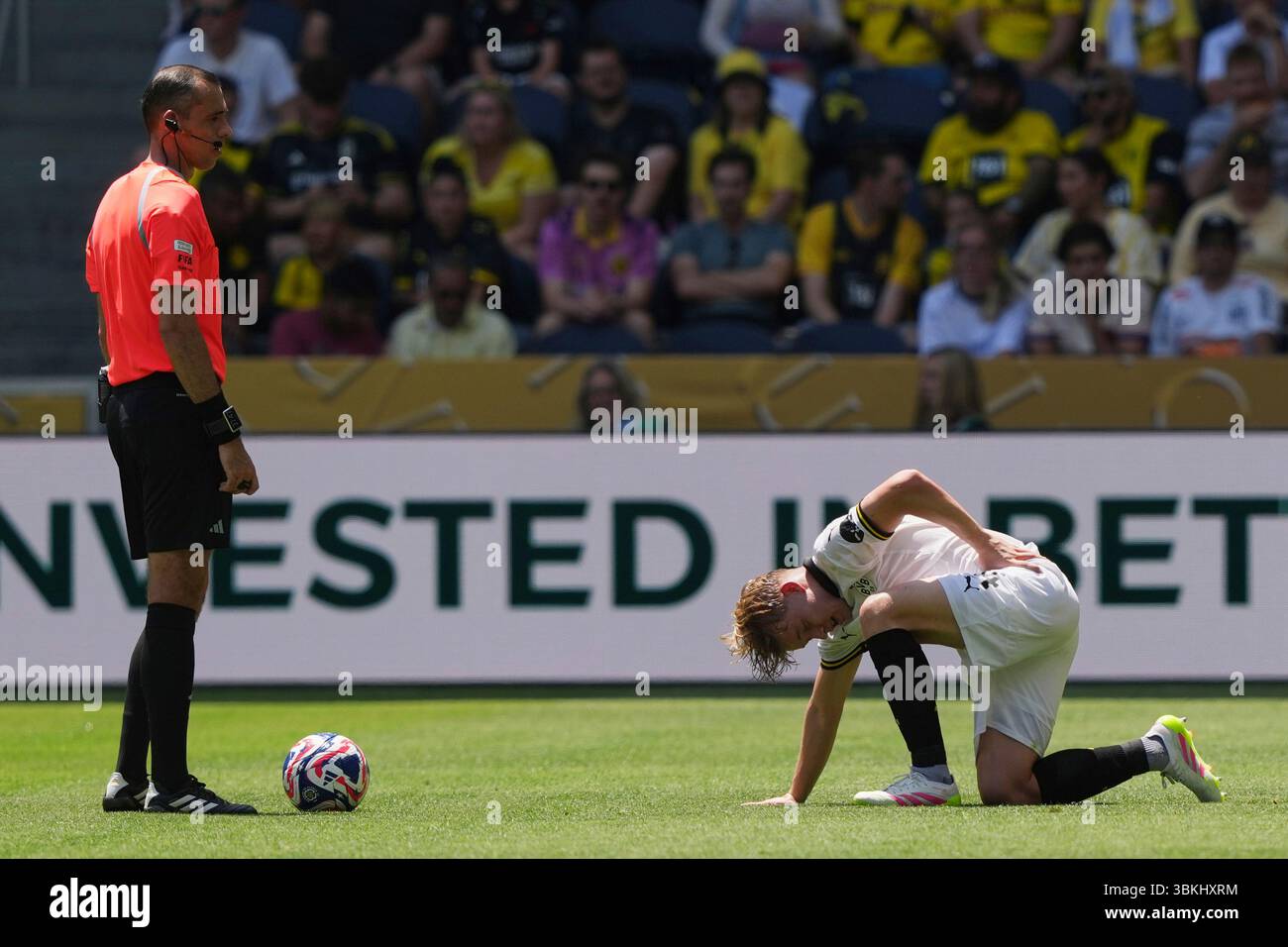 Borussia Dortmund's Daniel Svensson, right, reacts after a hard ...