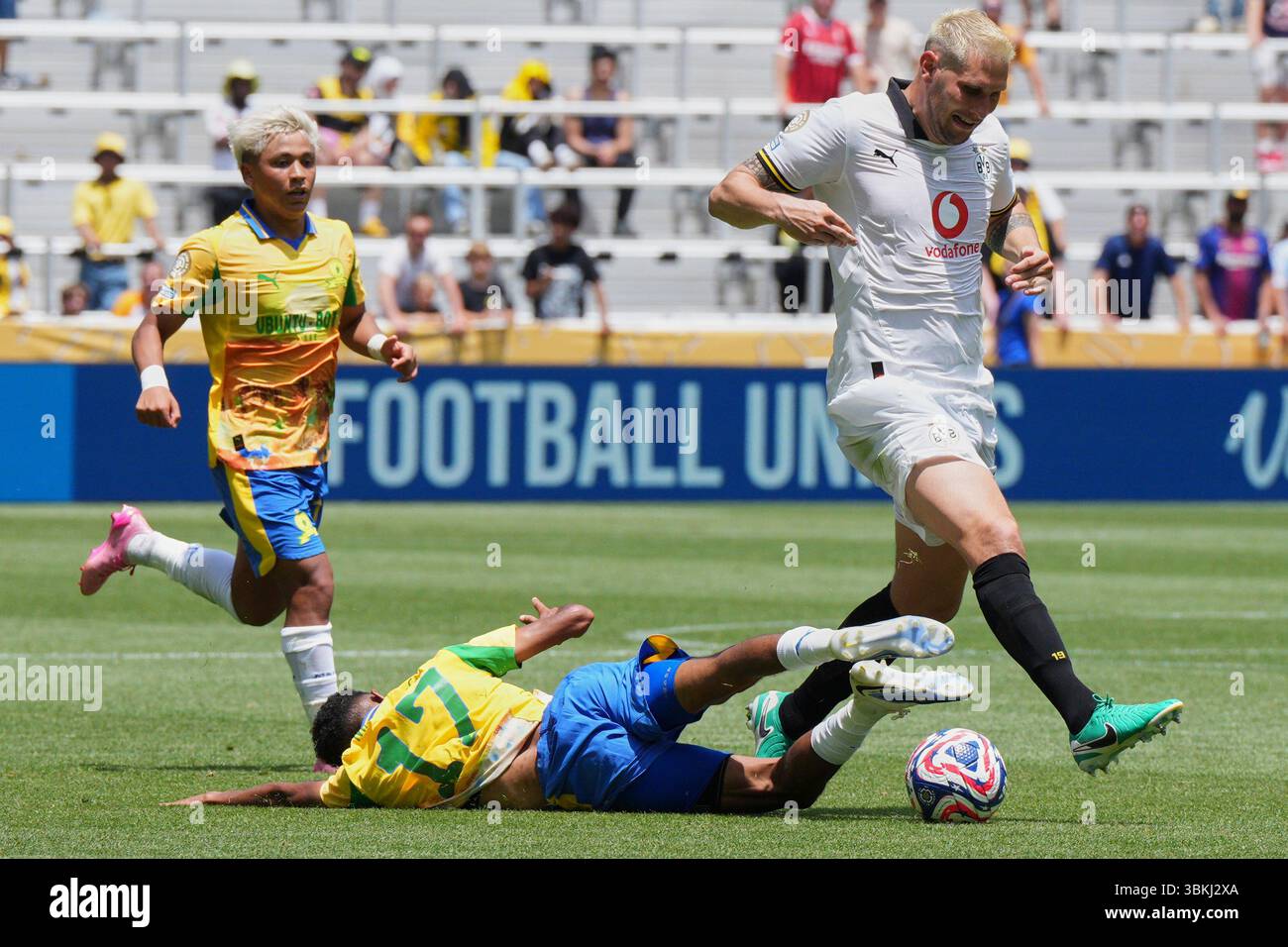 Mamelodi Sundowns' Tashreeq Matthews tackles Borussia Dortmund's Niklas ...