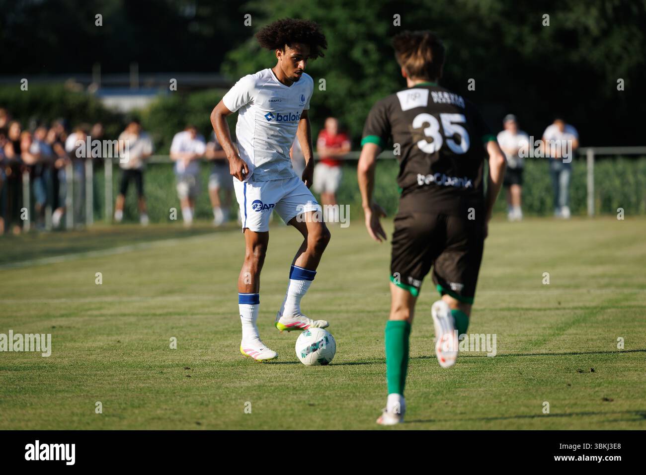 Zelzate, Belgium. 21st June, 2025. Gent's Hugo Gambor fights for the ...