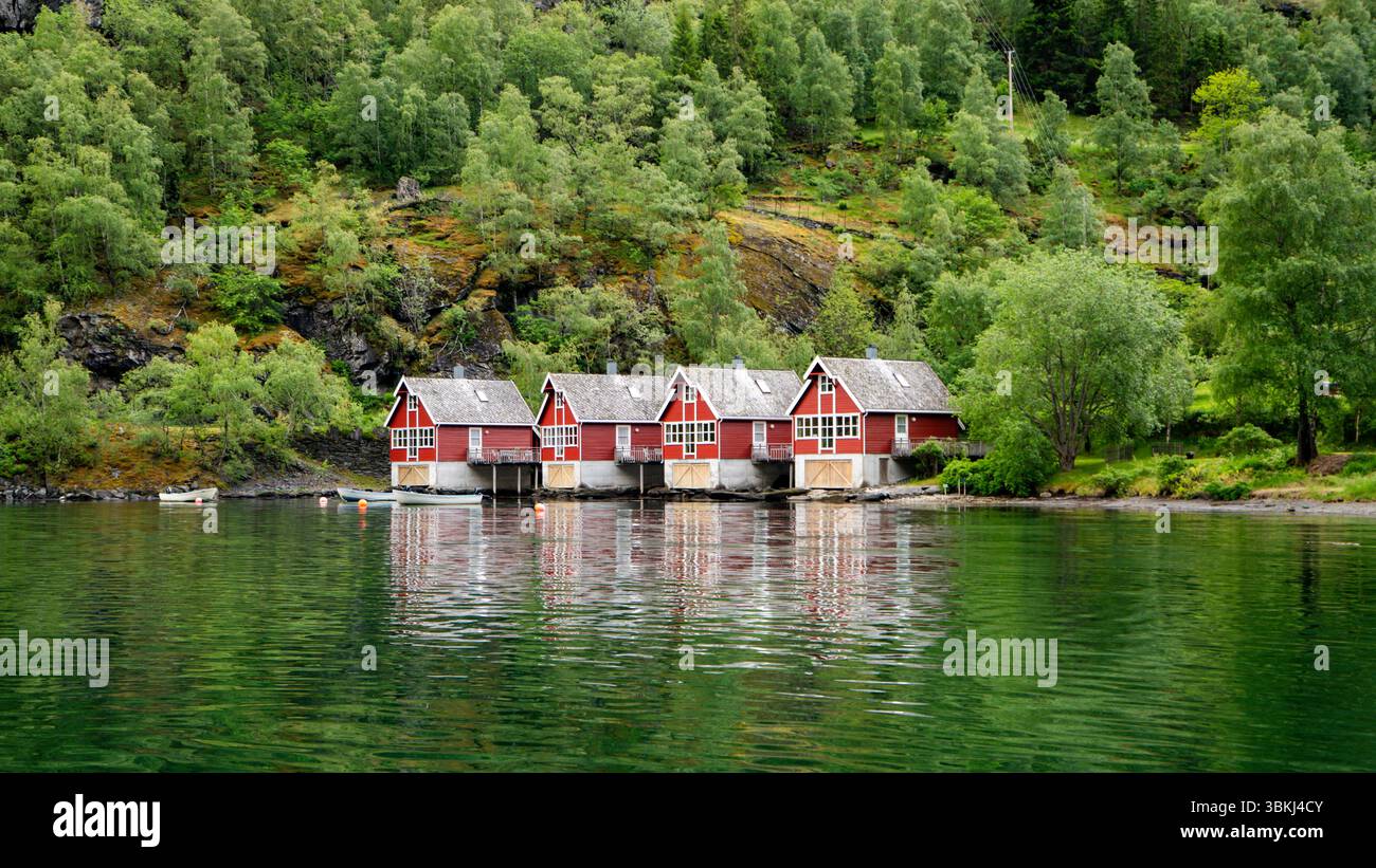 Traditional red boathouses reflecting in hi-res stock photography and ...