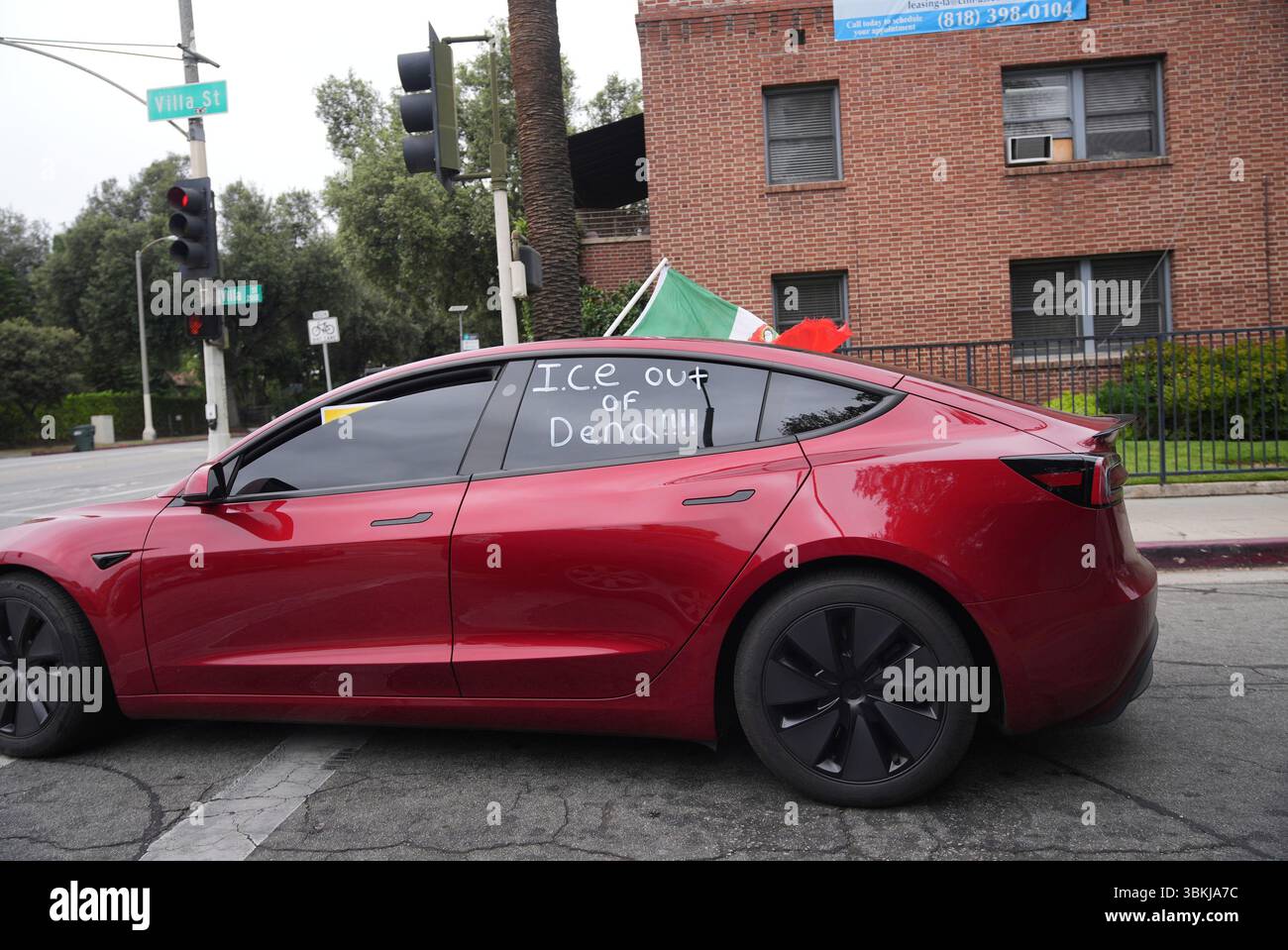 A sign is placed on the window of a vehicle in reaction to morning ICE ...