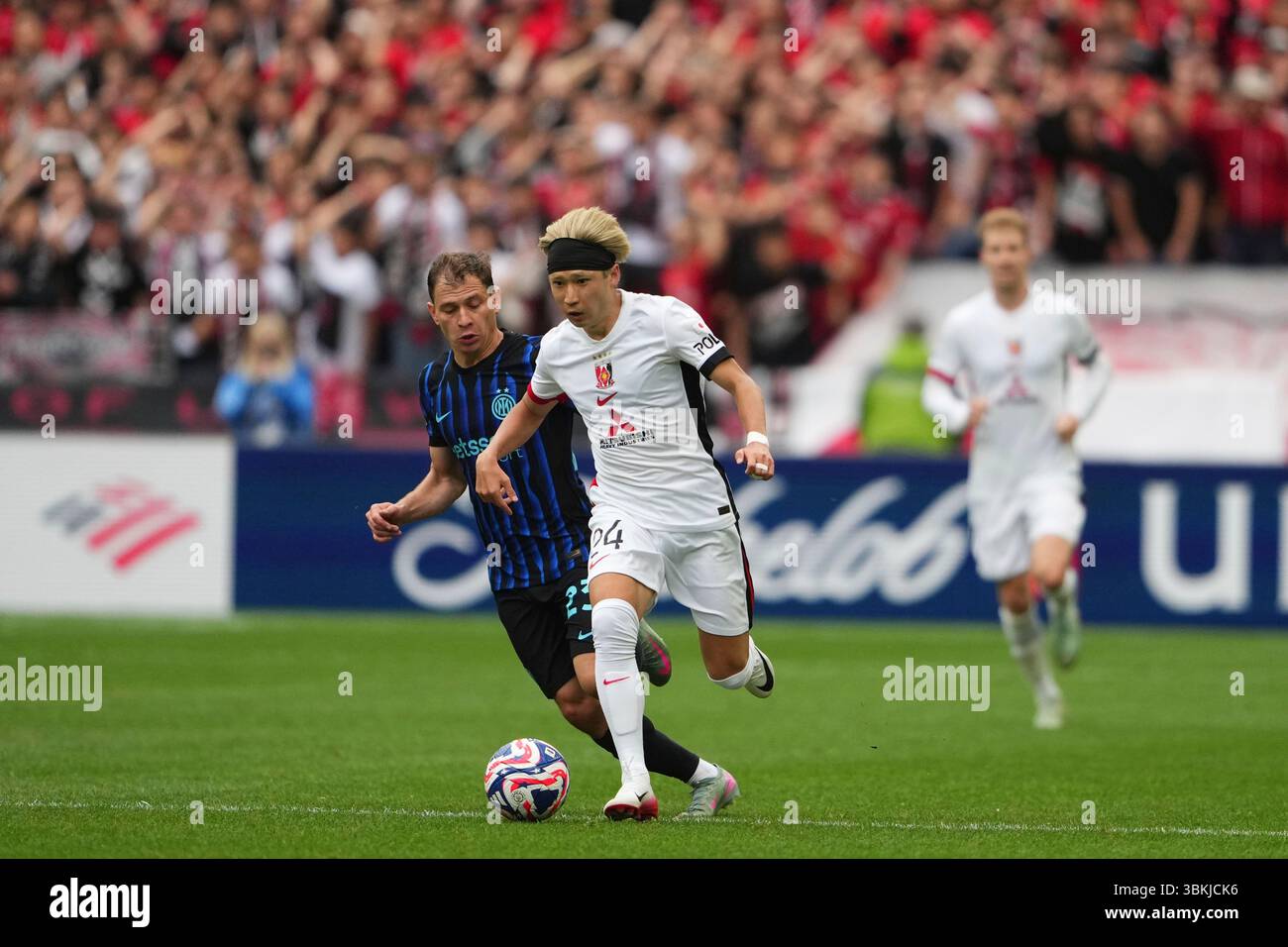 Inter Milan's Nicolo Barella, left, and Urawa Red Diamonds' Yusuke ...