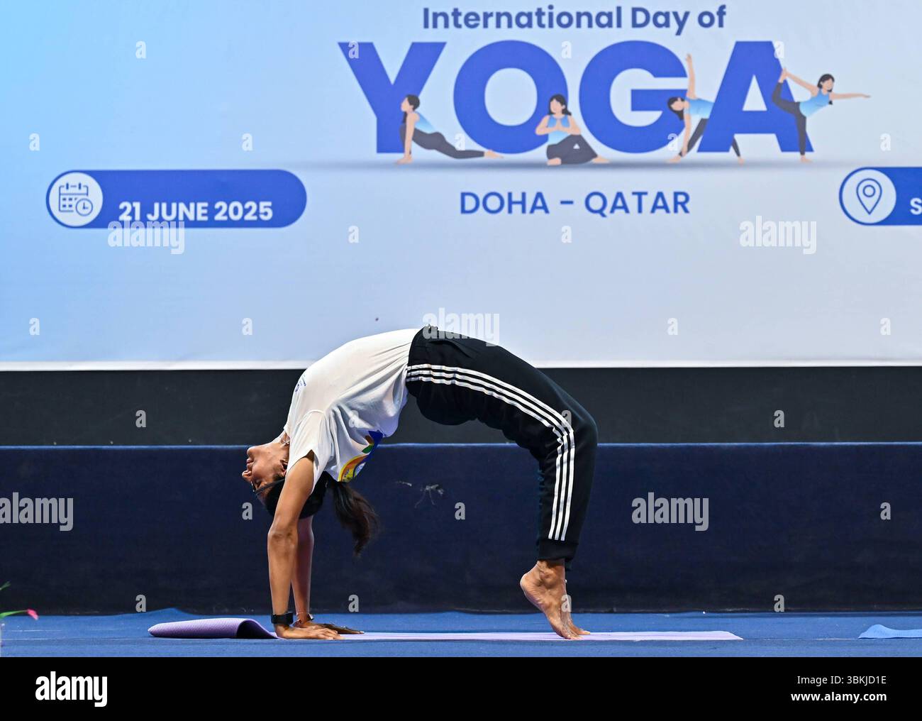 INTERNATIONAL DAY OF YOGA IN DOHA A woman participates in a yoga ...