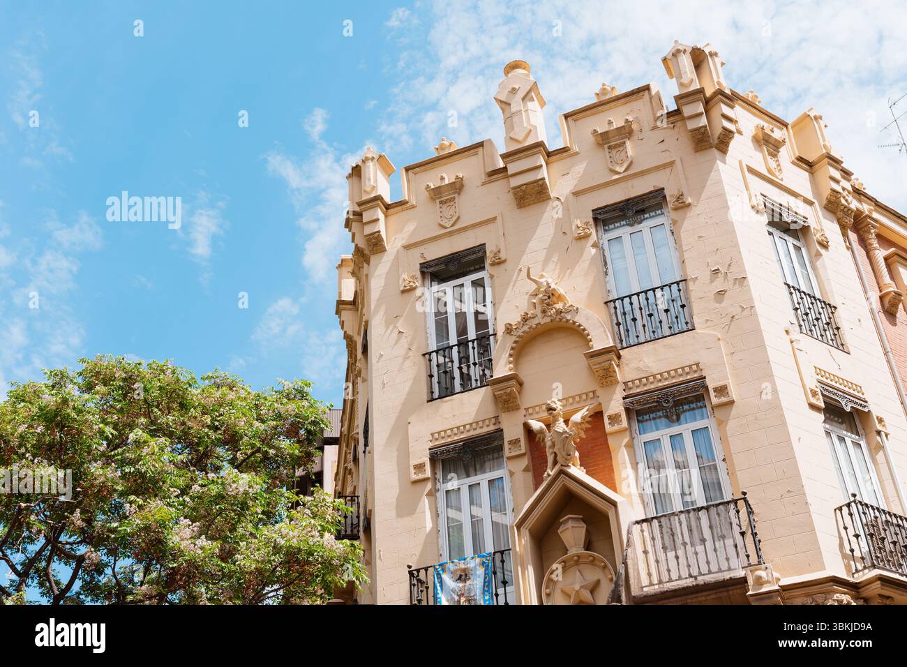 Ornate vintage building with dragon sculptures and curved details on ...