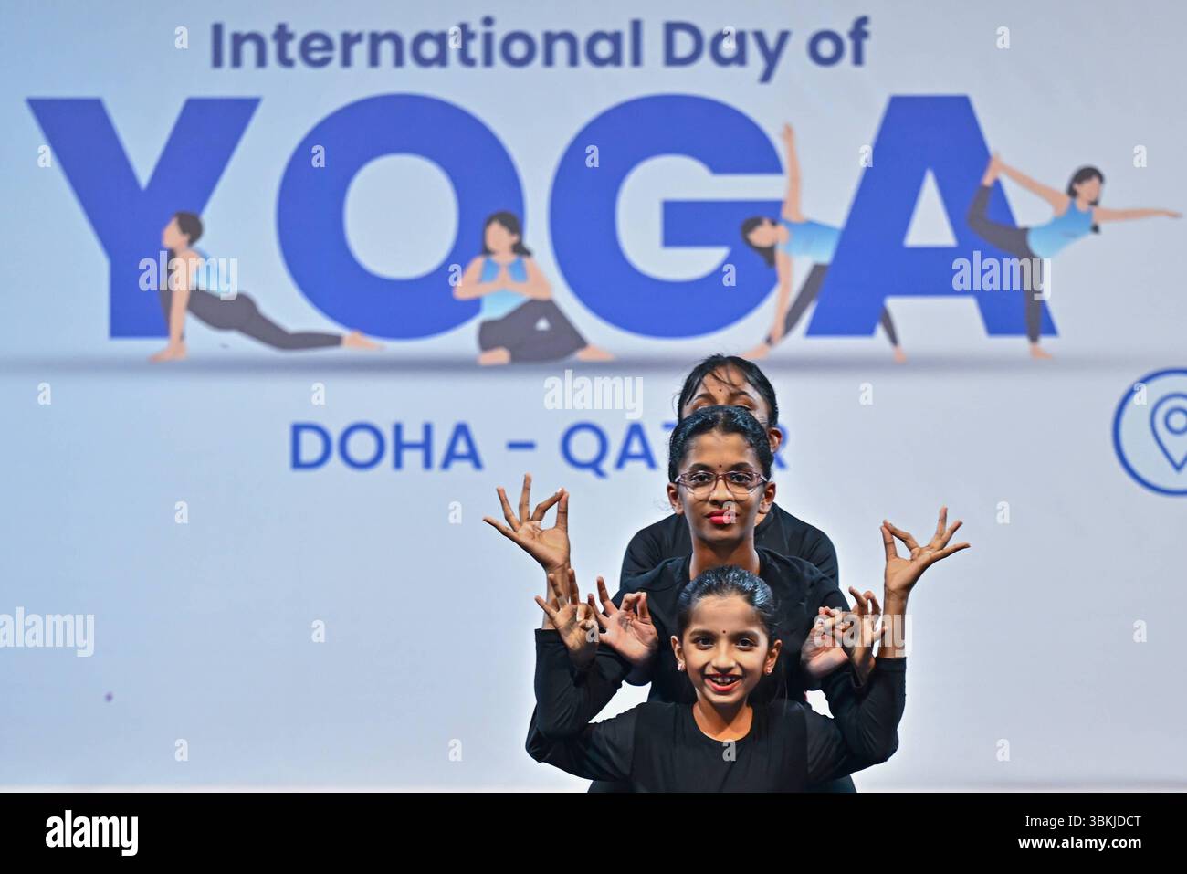 INTERNATIONAL DAY OF YOGA IN DOHA Children participate in a yoga ...