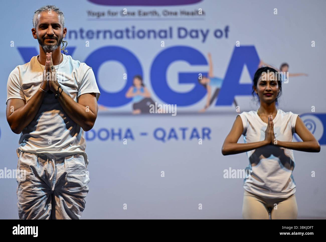 INTERNATIONAL DAY OF YOGA IN DOHA People participate in a yoga session ...