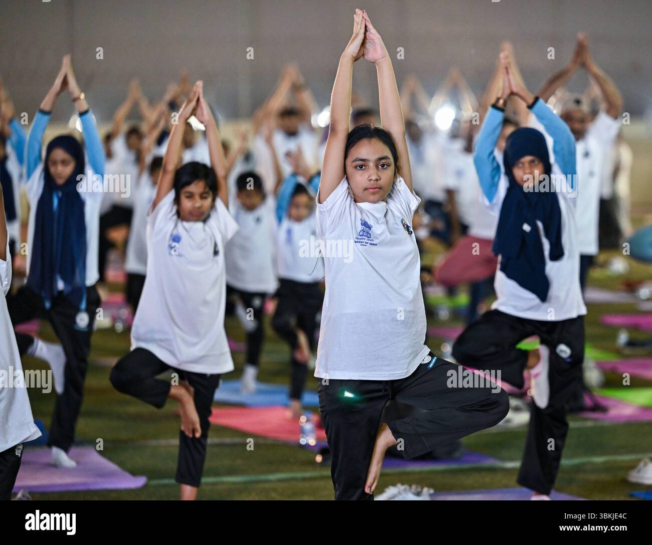 INTERNATIONAL DAY OF YOGA IN DOHA People participate in a yoga session ...