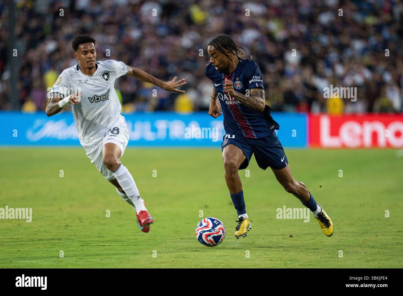 Paris Saint-Germain forward Bradley Barcola (29) is defended by ...