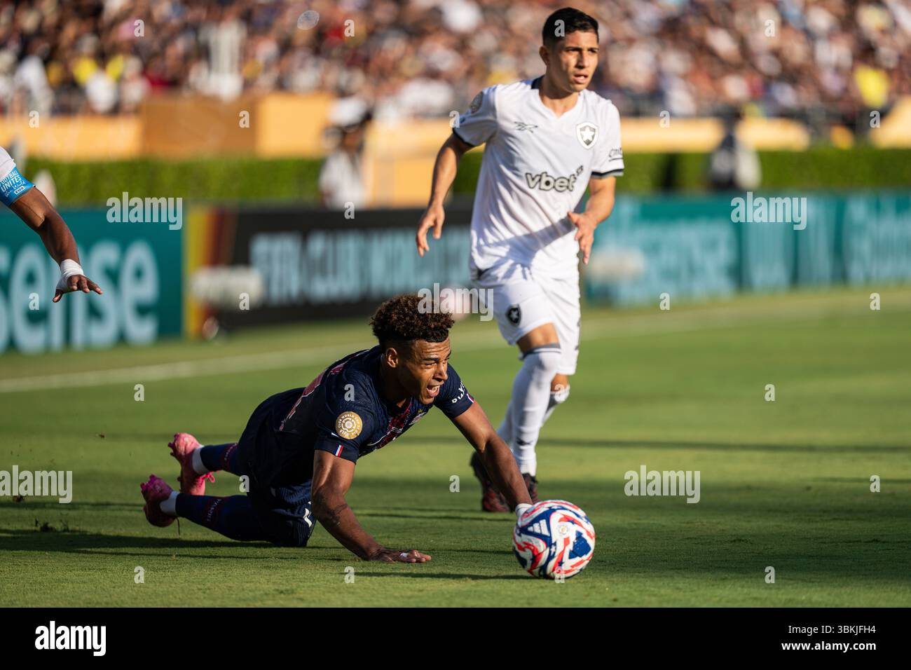 Paris Saint-Germain forward Desire Doue (14) reacts as he falls during ...
