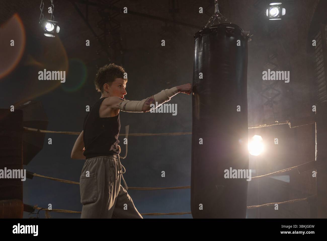 Boxing with a punching bag, sports achievements concept, female ...