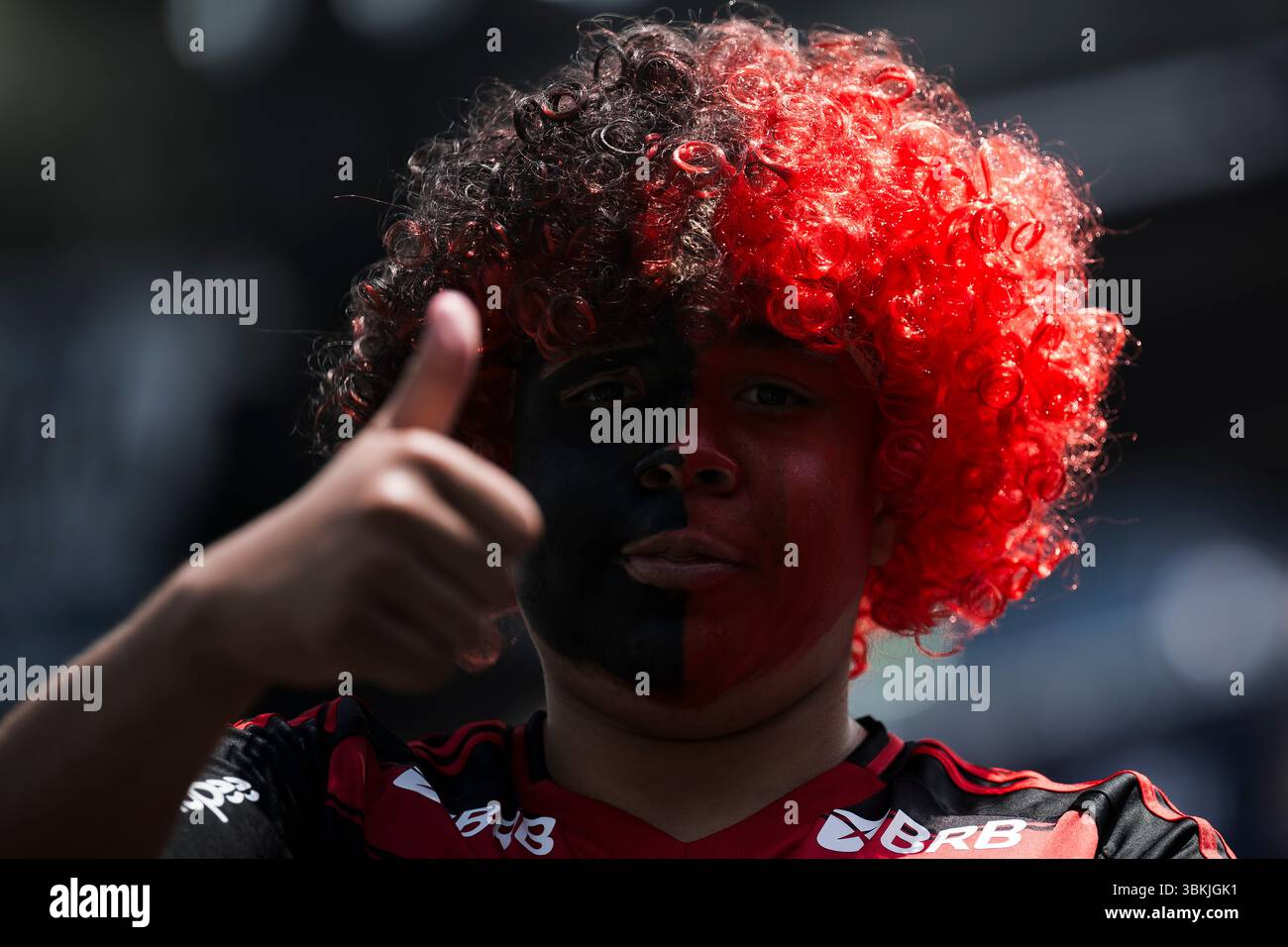 A fan of CR Flamengo wearing a wig shows his support during the FIFA ...