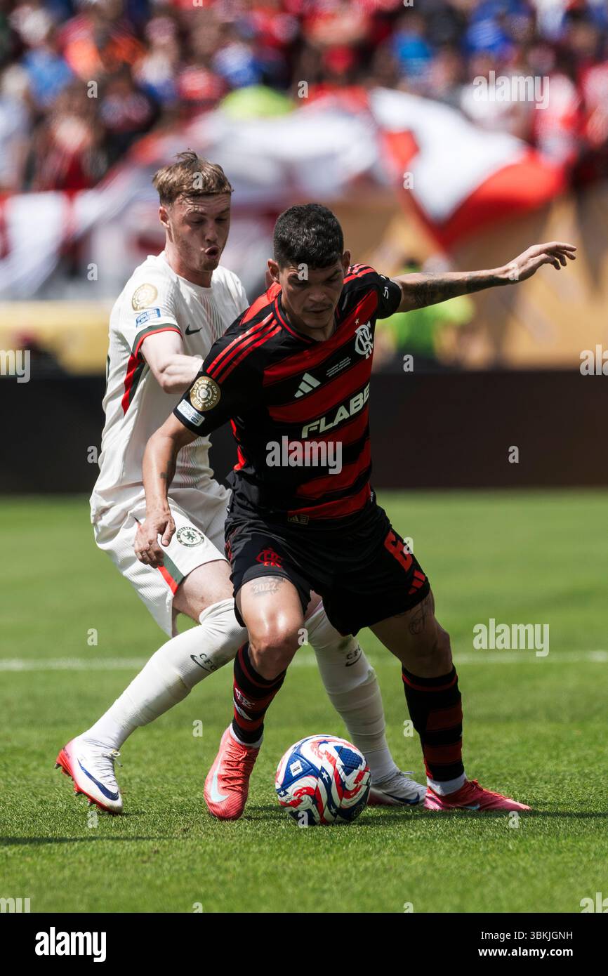 Ayrton Lucas of CR Flamengo competes for the ball with Cole Palmer of ...