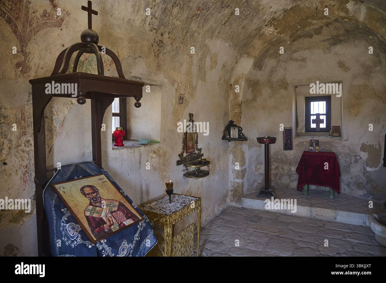 Interior view of a small chapel with icons and religious symbols on the ...